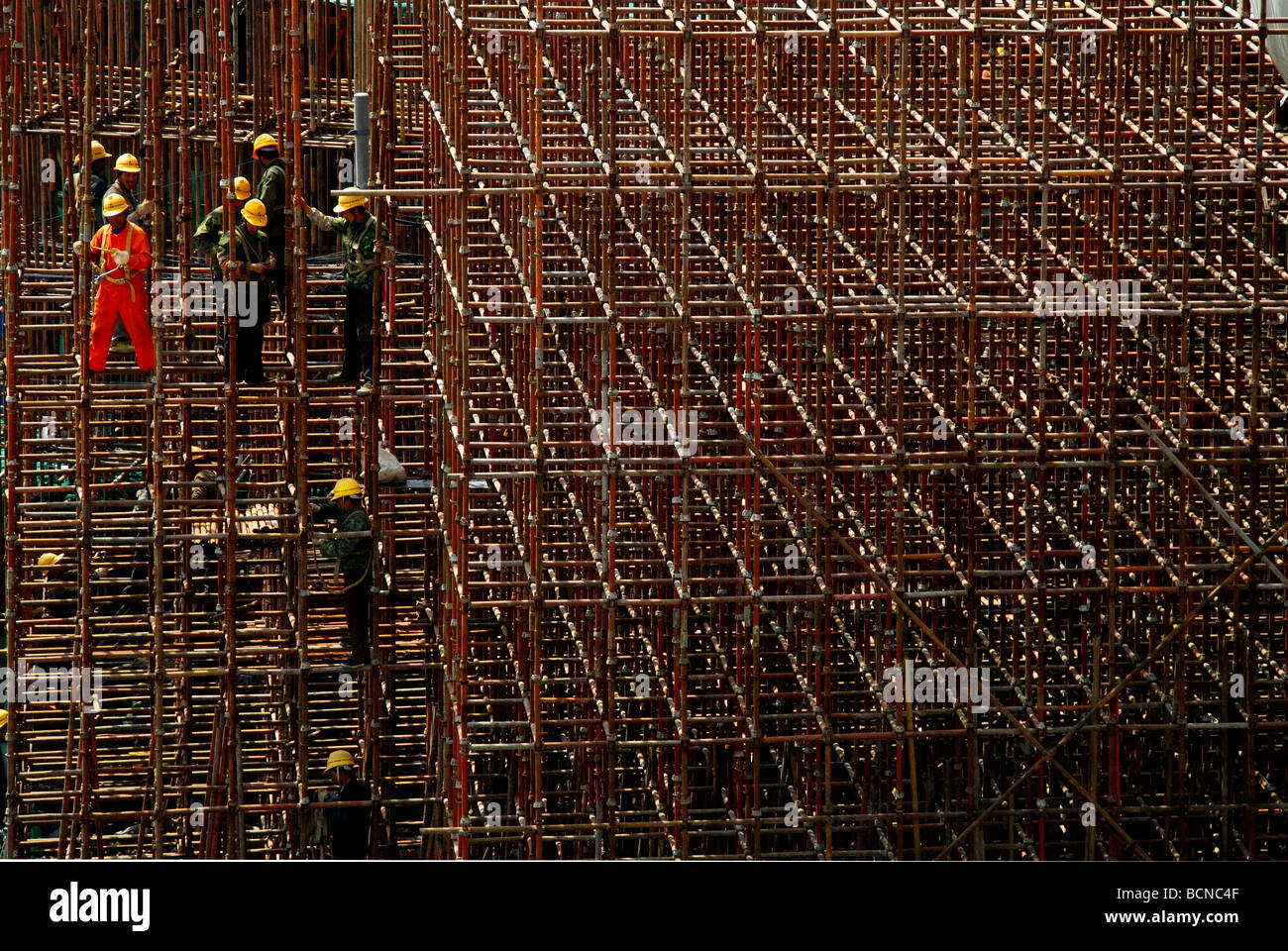 Construction workers on scaffold, Shanghai, china Stock Photo - Alamy