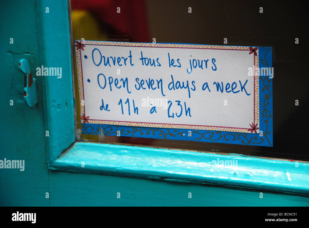 sign indicating business hours of French shop Stock Photo - Alamy