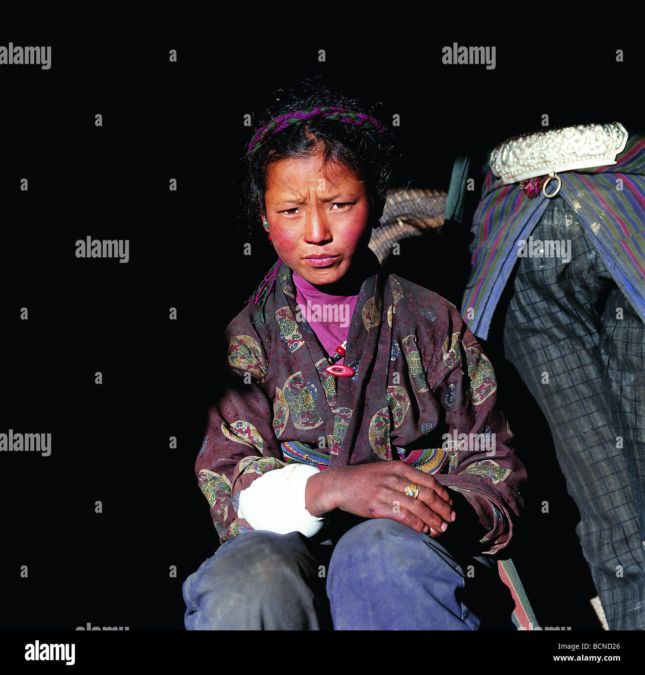 Tibetan girl in traditional Tibean clothing in Tibetan village in ...
