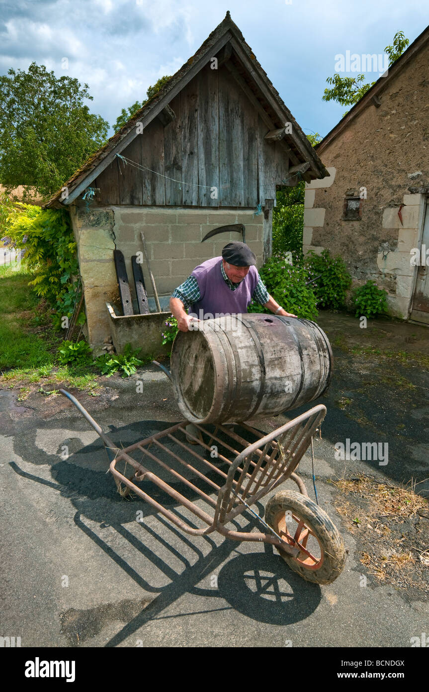 Farmer loading wine barrel onto handcart - sud-Touraine, France Stock ...