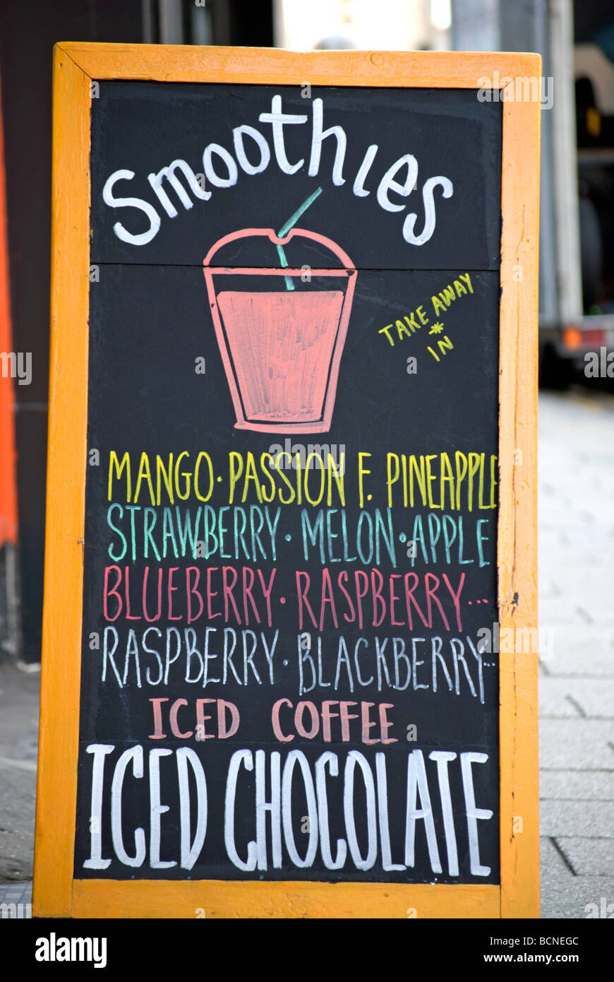 handmade sign for fruit smoothies, iced coffee and iced chocolate in ...