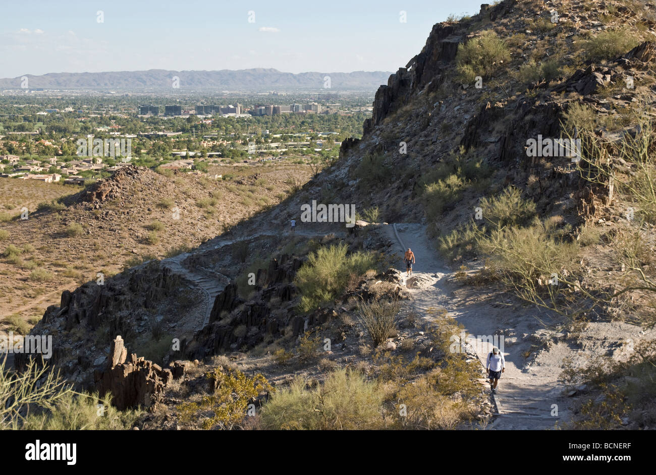 hikers climb the summit trail of Piestewa Peak (formerly Squaw Peak) in ...