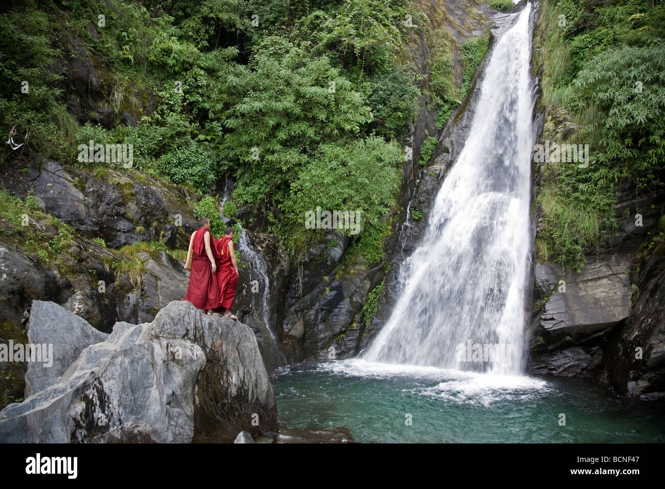 Buddhist monks bhagsu nag waterfall hi-res stock photography and images ...