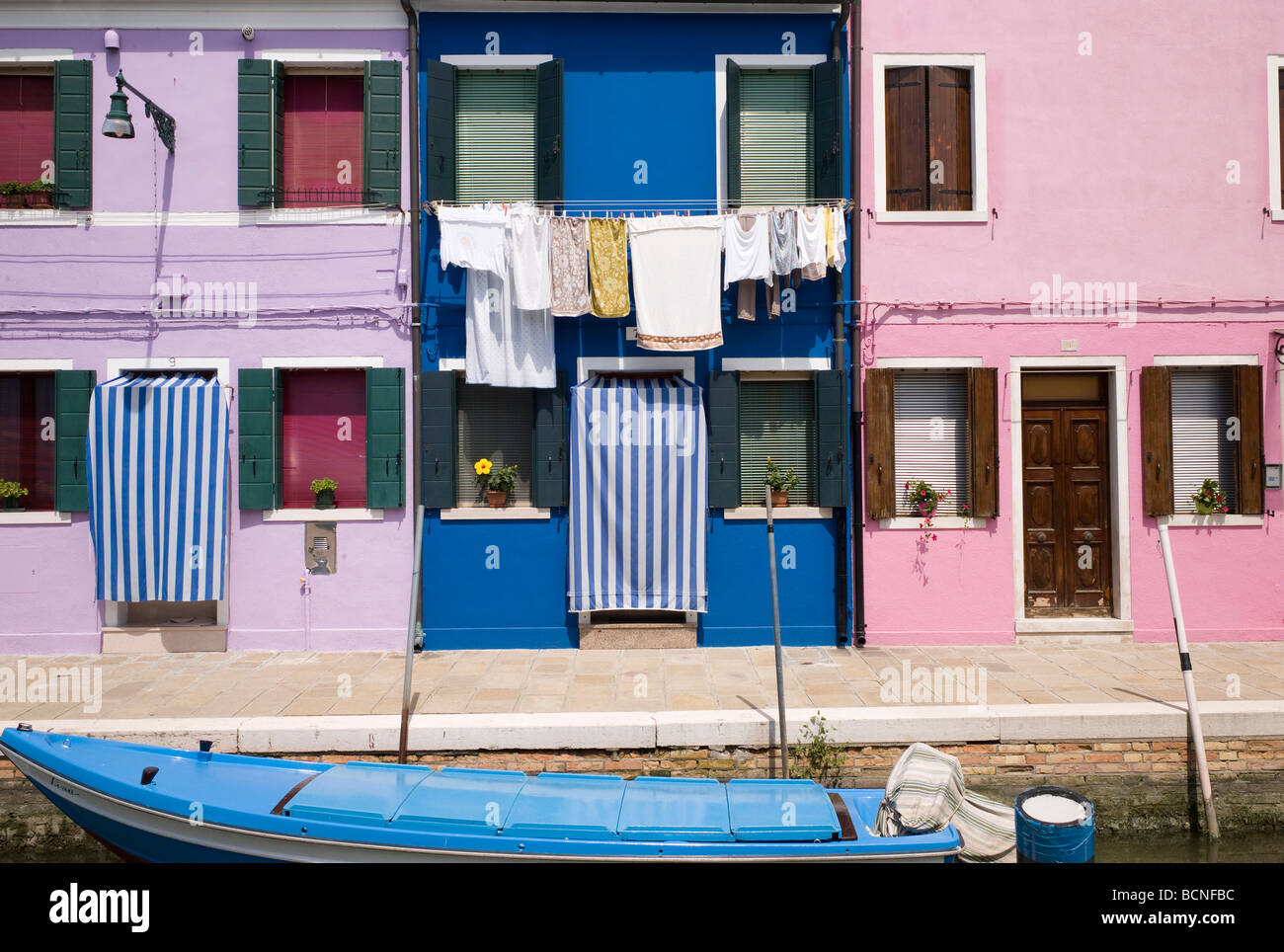 brightly coloured house fronts Stock Photo - Alamy
