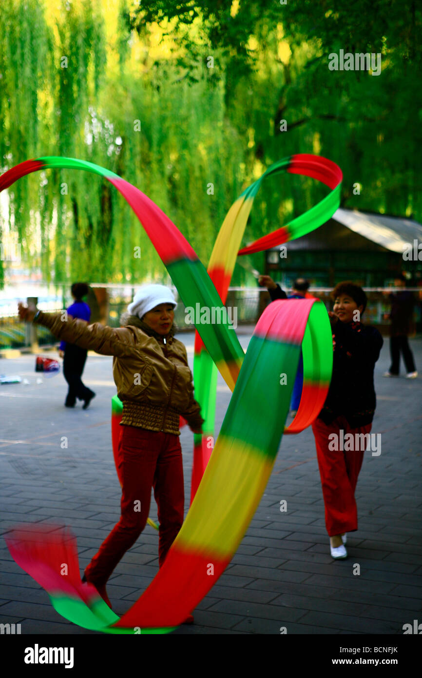 Chinese women practicing Long Silk Dance in the morning, Beihai Park ...