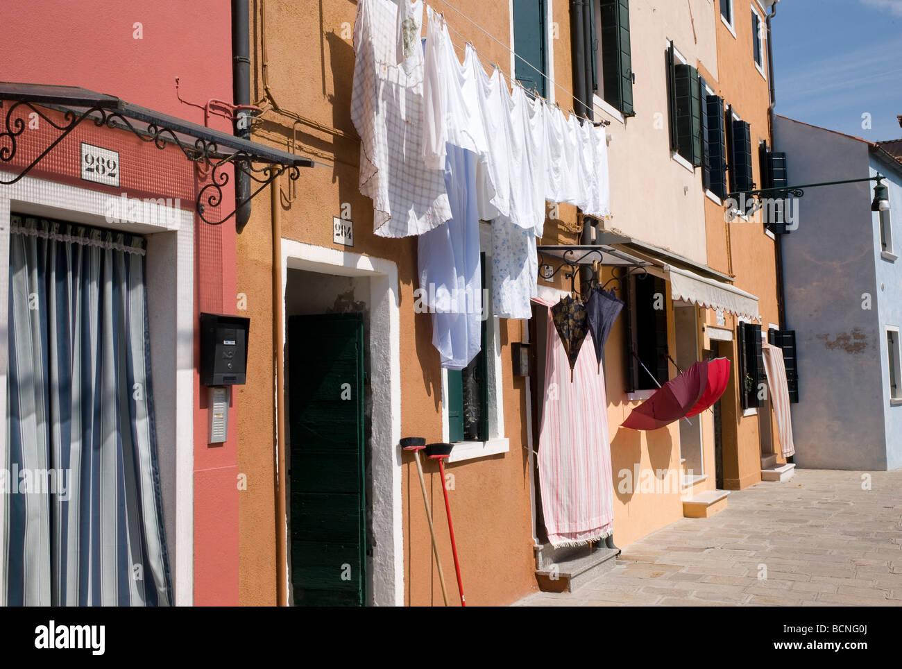 brightly coloured house fronts Stock Photo - Alamy