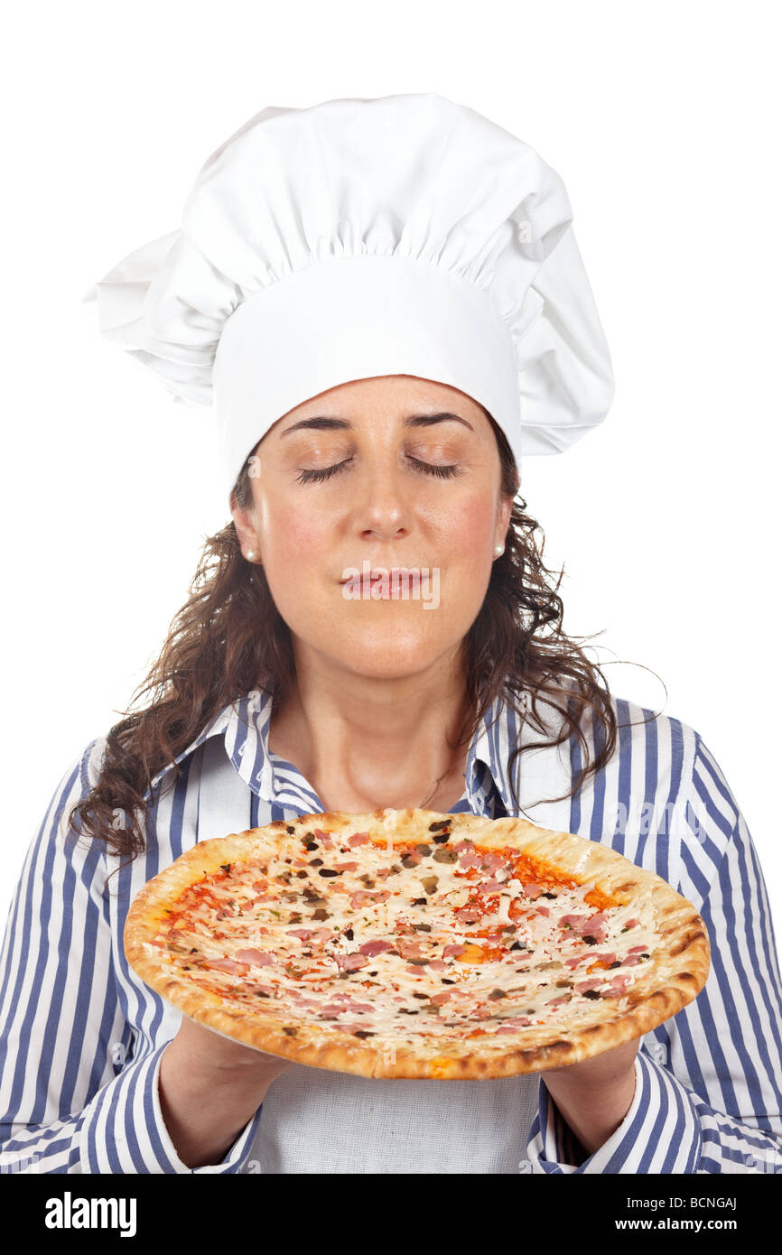 Attractive cook woman smelling a tasty Italian pizza Stock Photo - Alamy