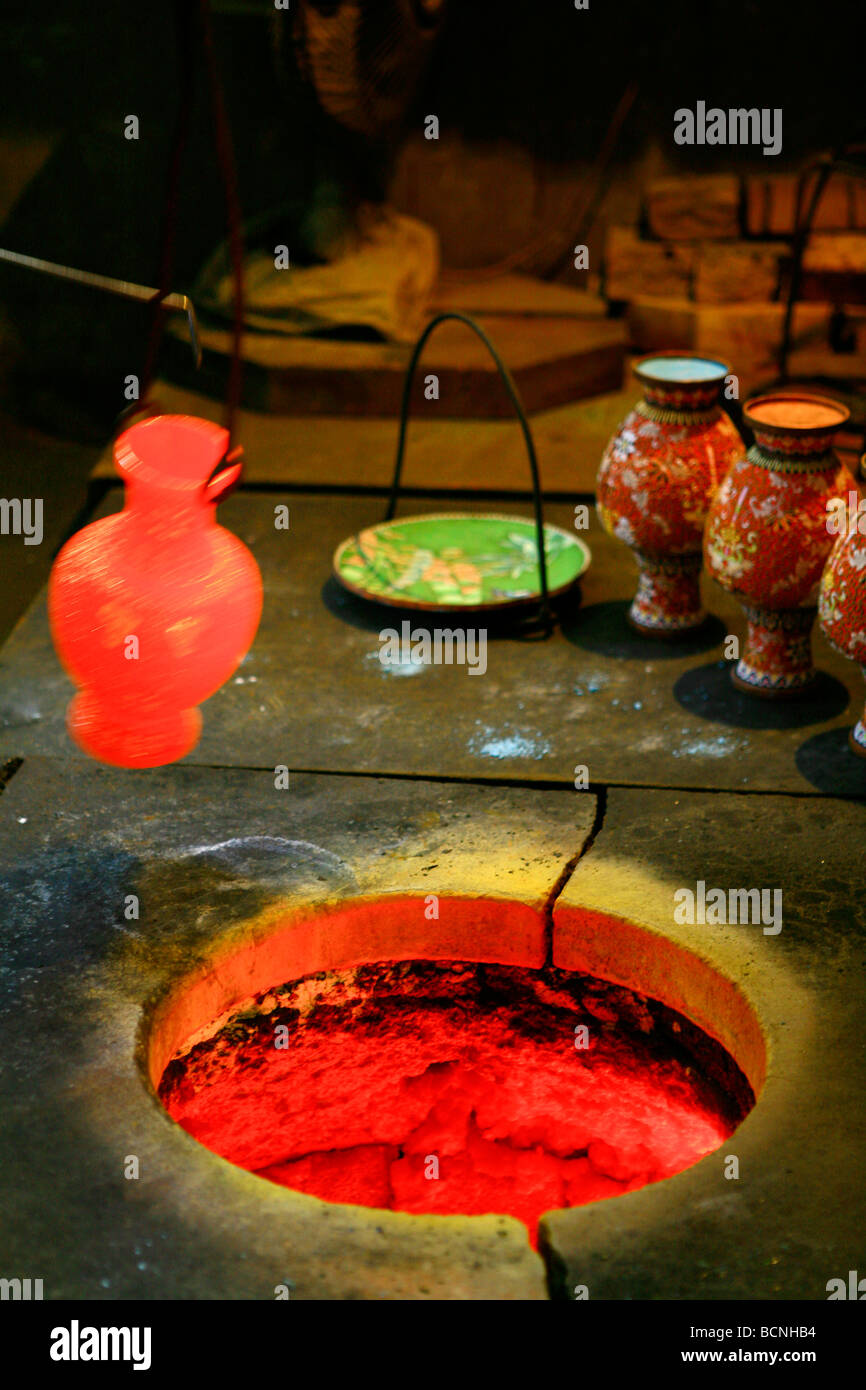 Enamel-firing process during making of a Cloisonné, Beijing, China ...