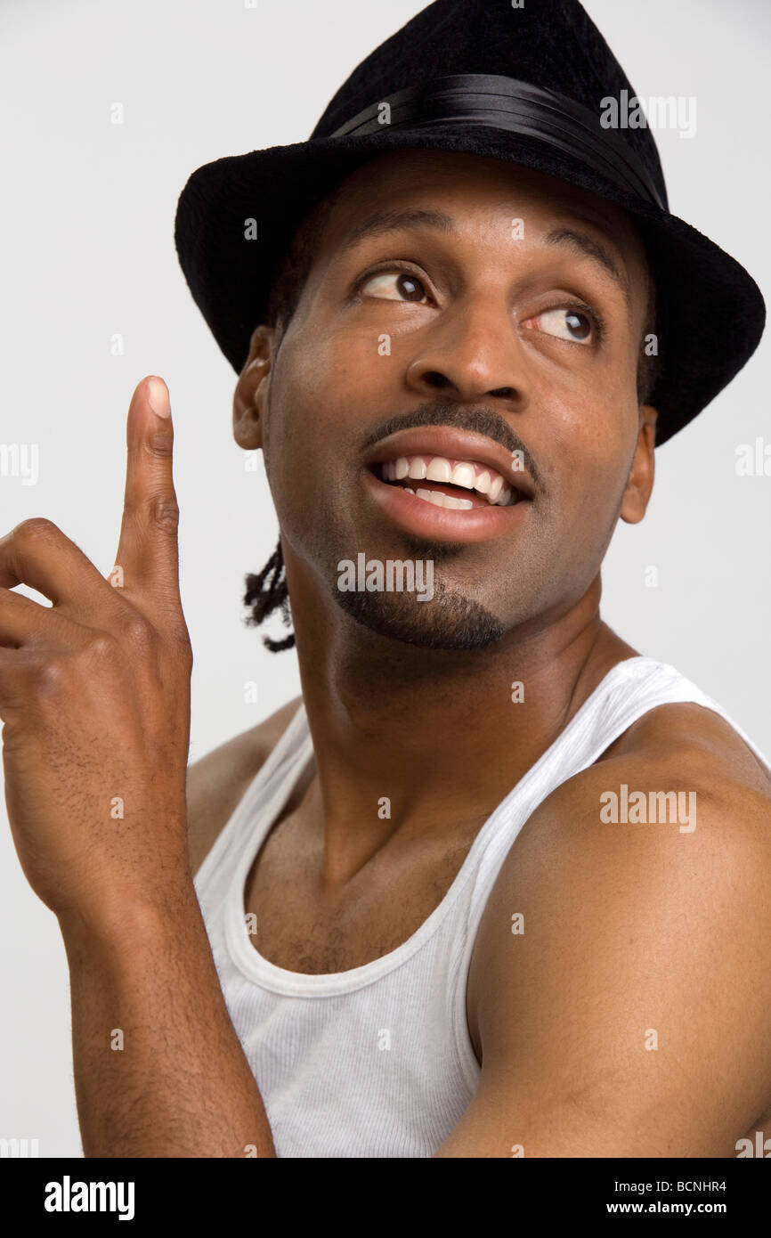 African American man holding up his finger with expression on his face ...