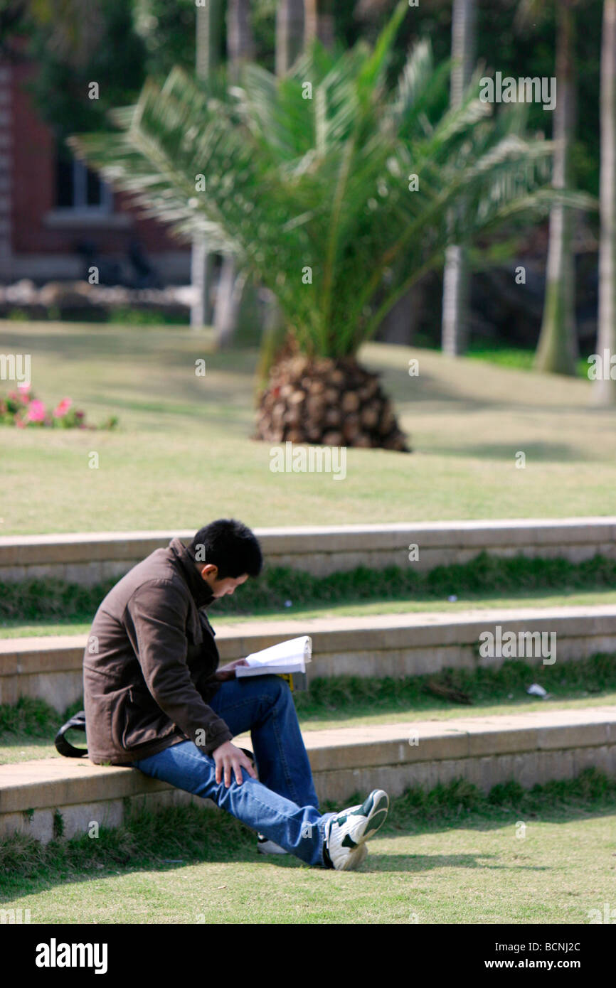 Chinese young man studying, Xiamen University, Xiamen, Fujian Province ...