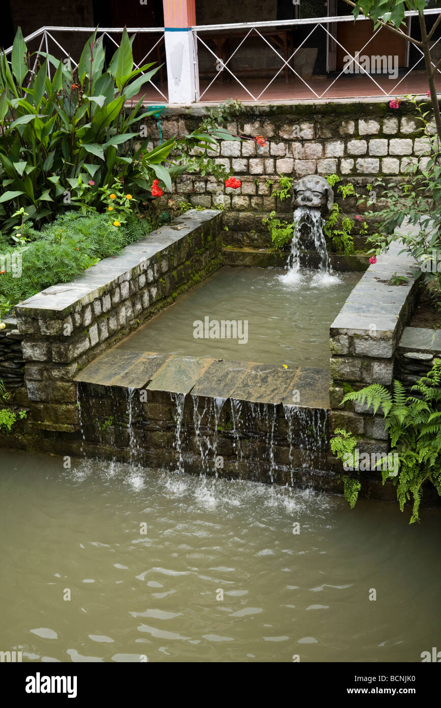 Pond with small waterfalls, in the garden at the Norbulingka institute ...