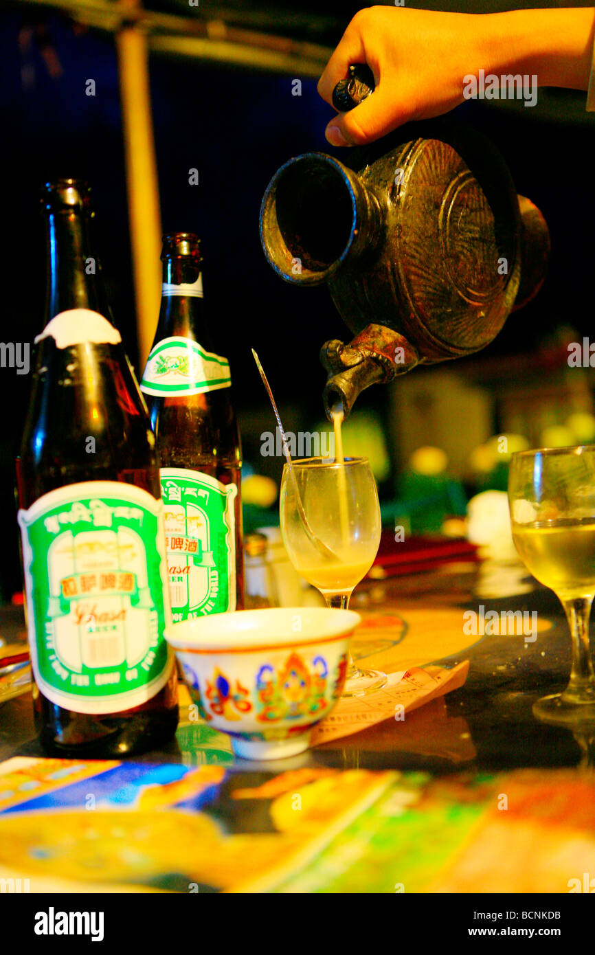 Barley wine and butter tea served in a local bar, Lhasa, Tibet ...