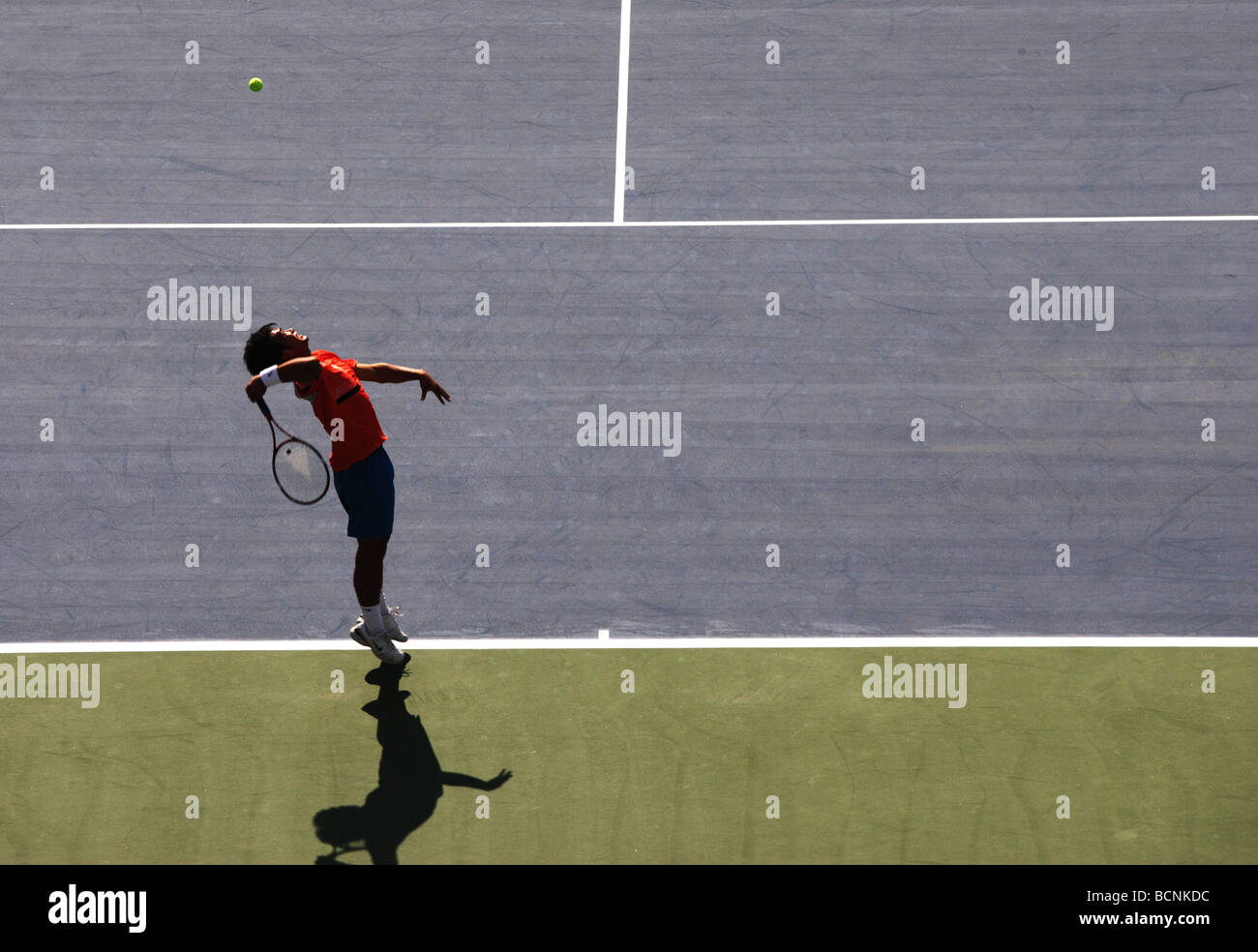 Tennis player hitting ball during a competition, Beijing, China Stock ...