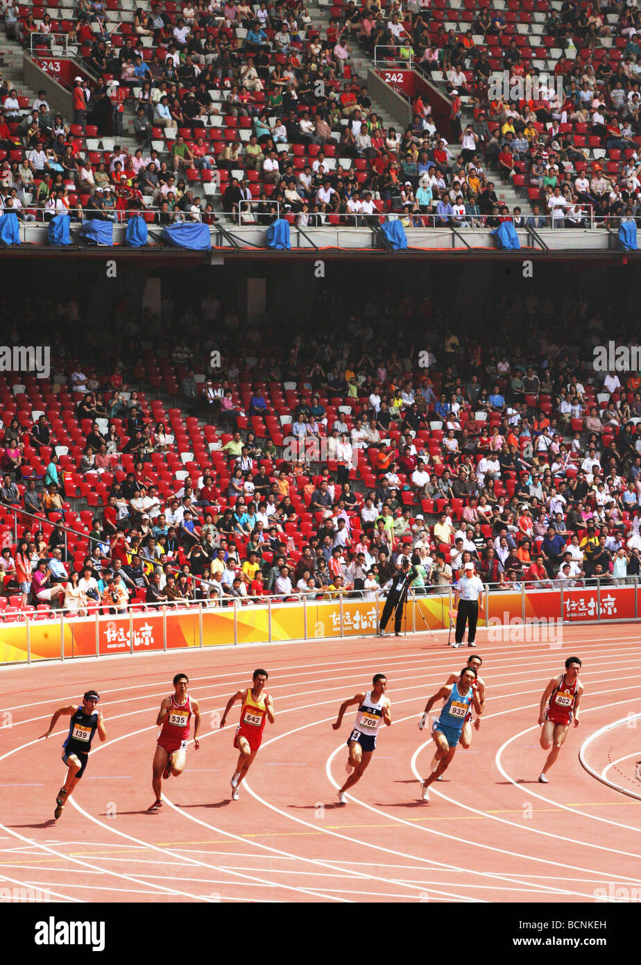 Chinese atheletes competing in 100m run during Good Luck Beijing Game ...