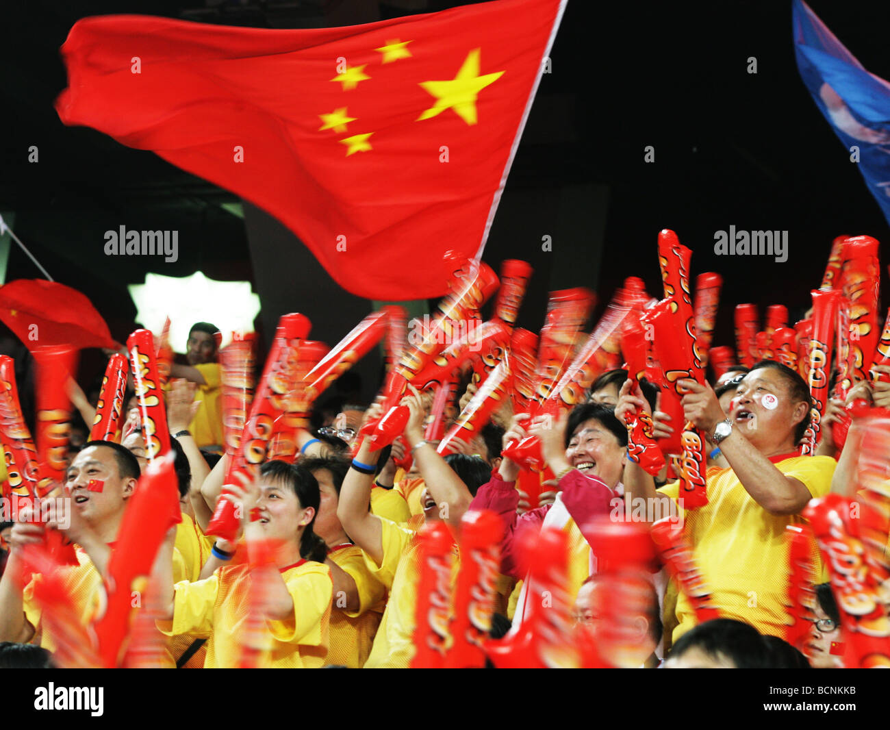 Fans in the audience waving flag of People's Republic of China, Beijing ...