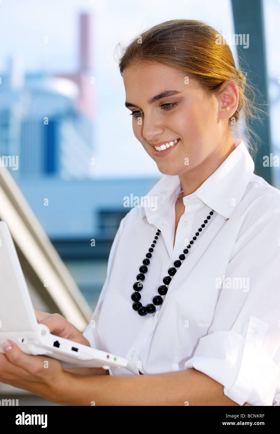 picture of happy businesswoman with laptop computer Stock Photo - Alamy