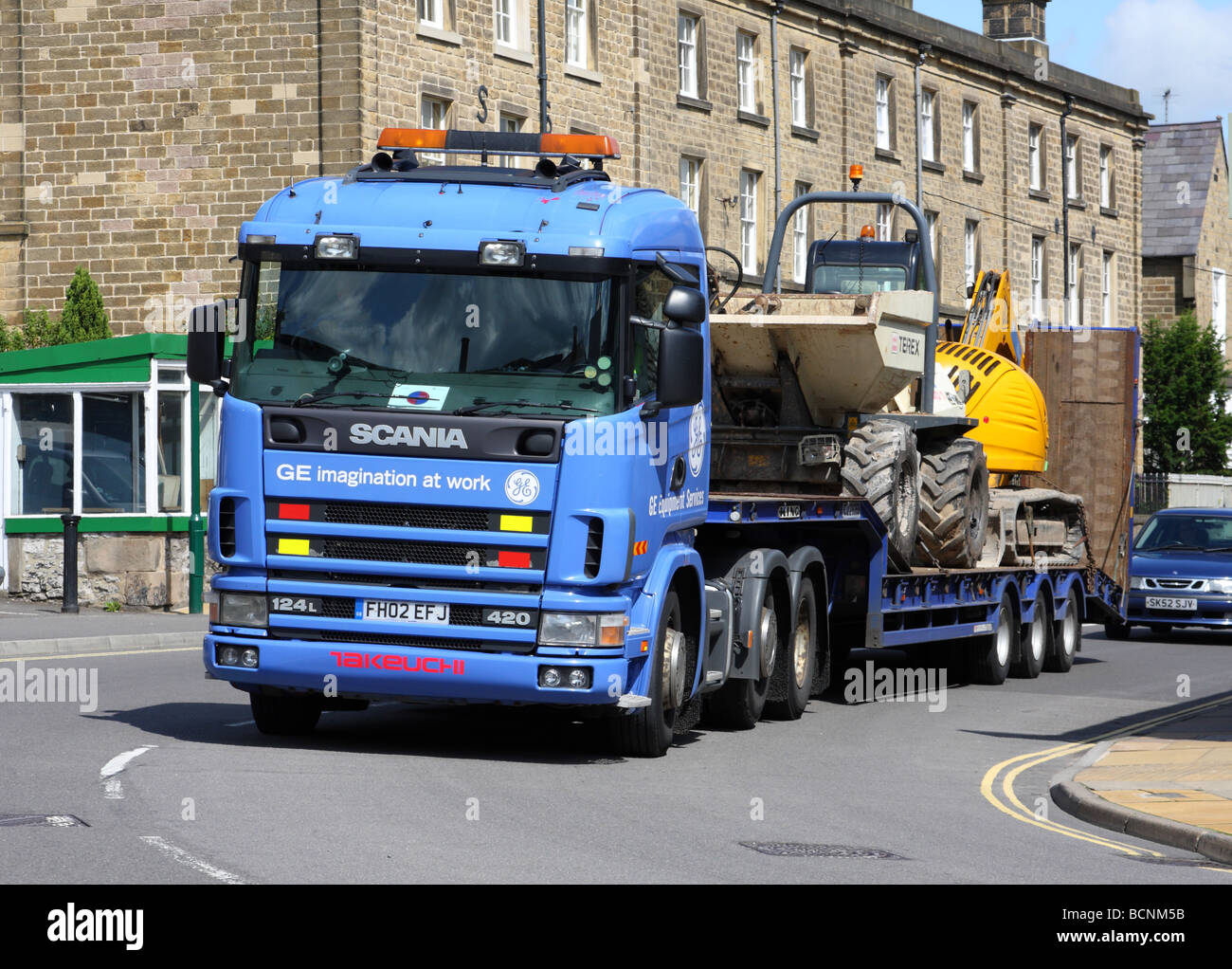 An articulated lorry on a narrow street in the U.K Stock Photo - Alamy