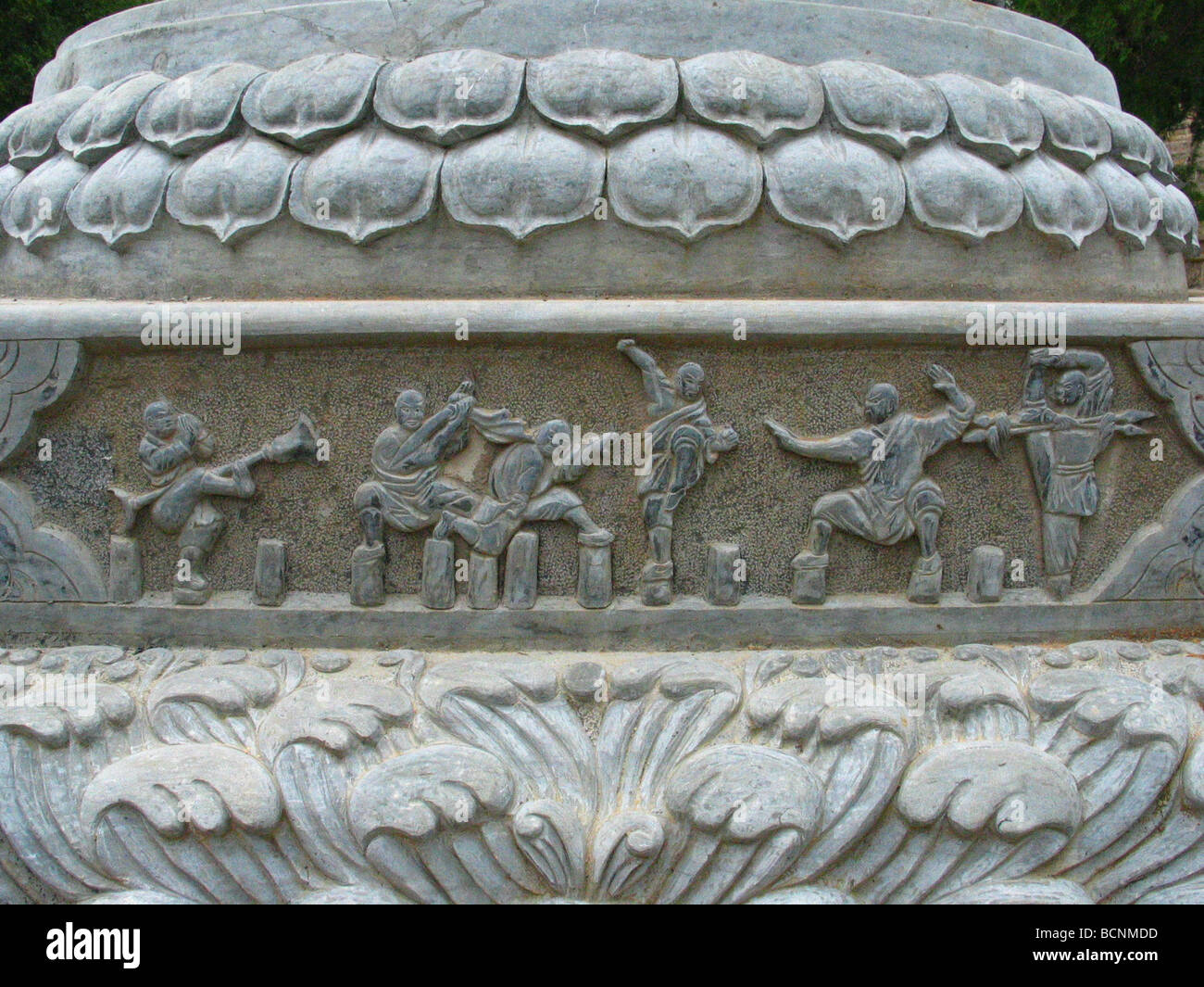 Stone carving of a pagoda portraying Shaolin monks practice Kongfu ...