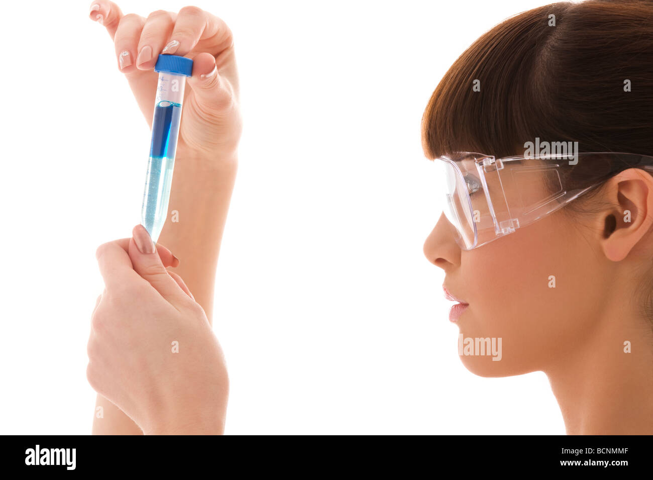 beautiful female lab worker holding up test tube Stock Photo - Alamy