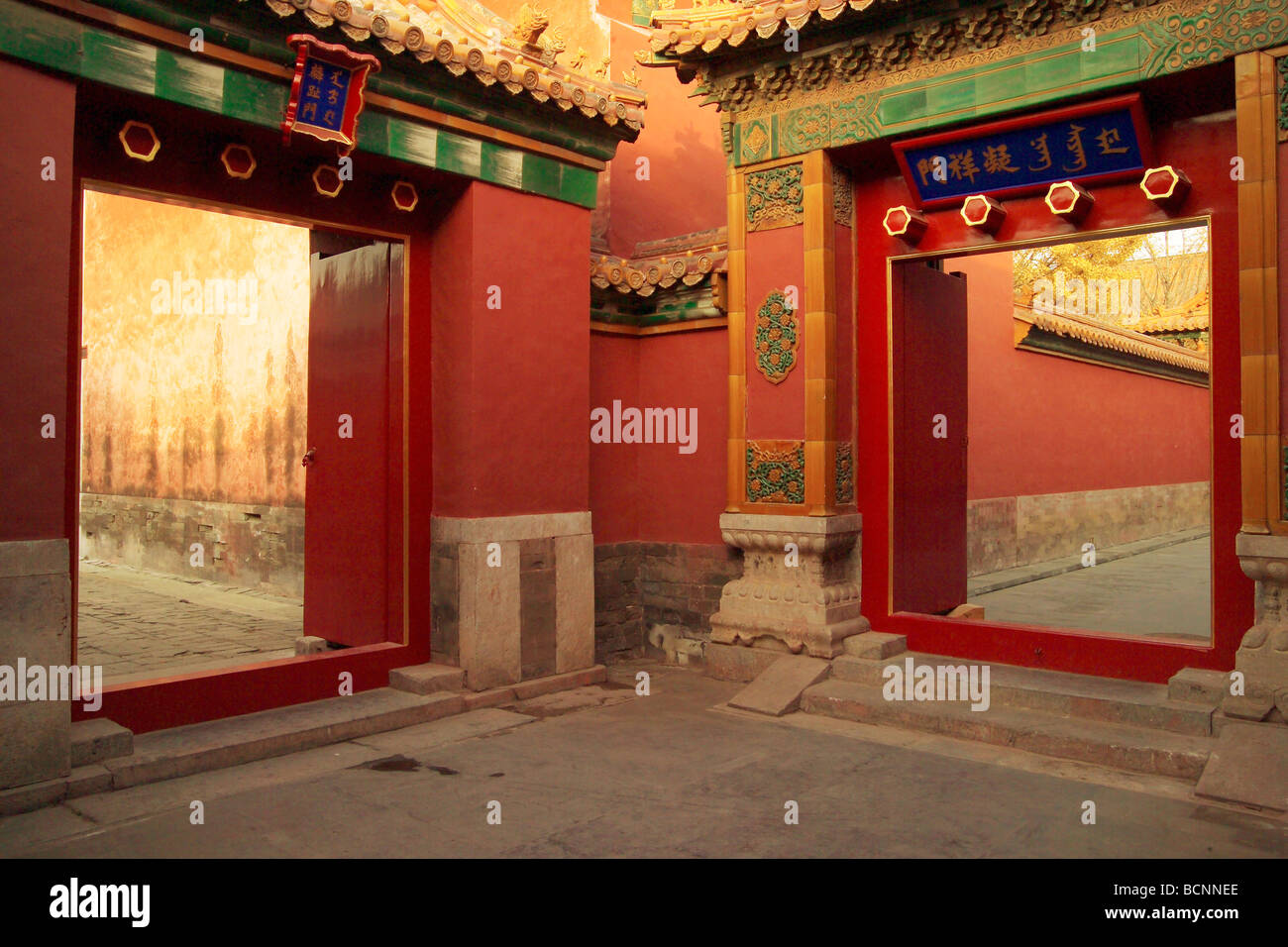 Two inner court palace gates with red wall and golden glazed roof tile ...