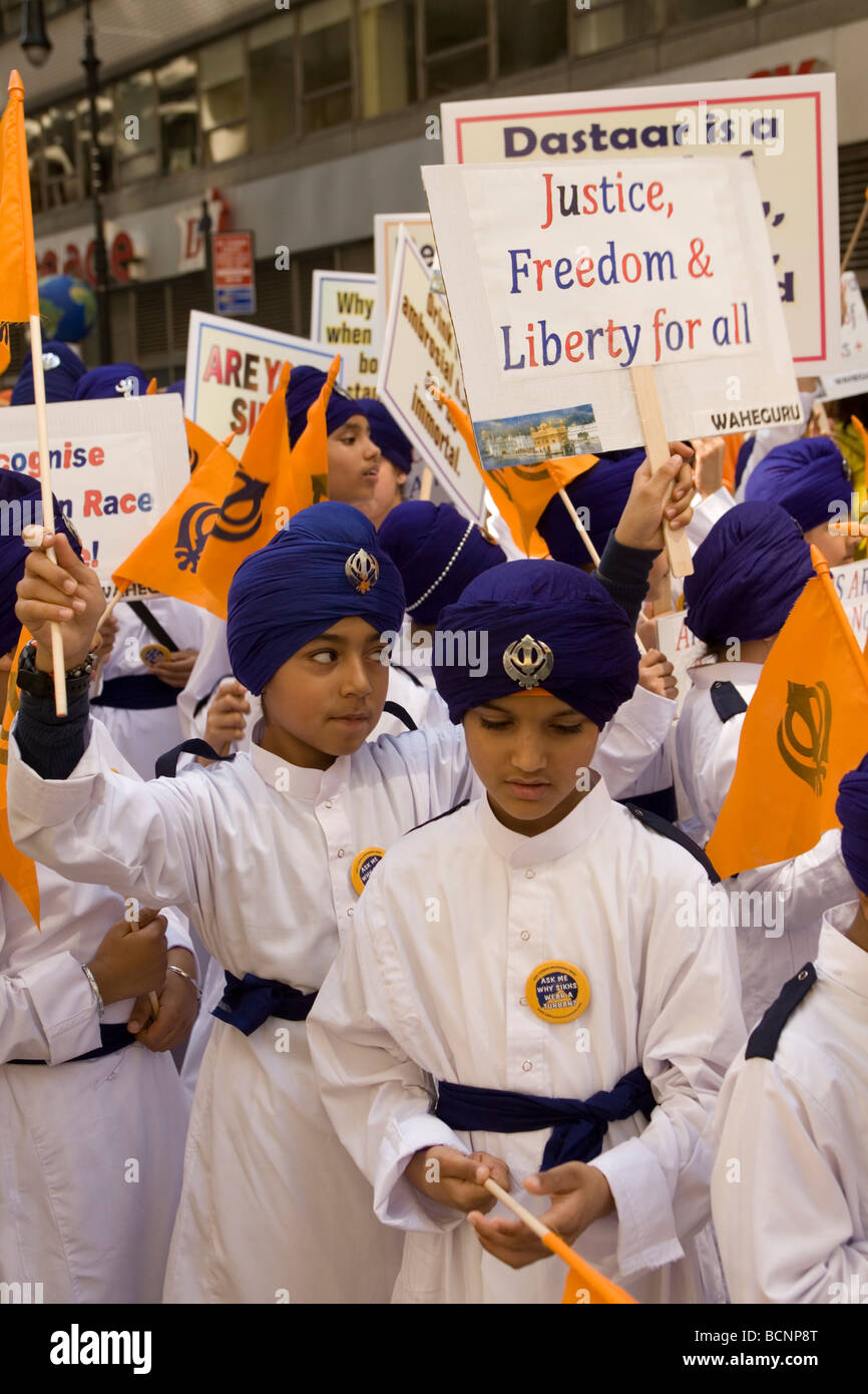 Sikh children carry placards that express Sikh principles at the 2009 ...