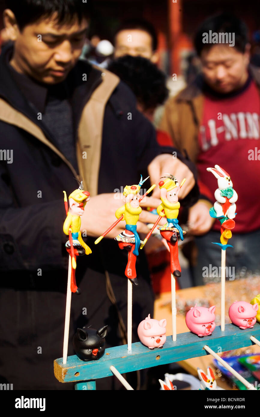 Craftsman making Traditional Chinese toy flour dolls in Dongyue Temple ...