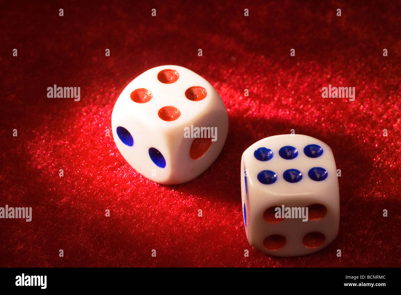 Two dices with red background Stock Photo - Alamy