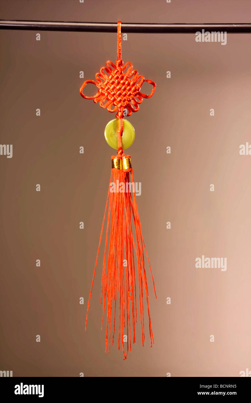 Chinese knot with jade piece Stock Photo - Alamy