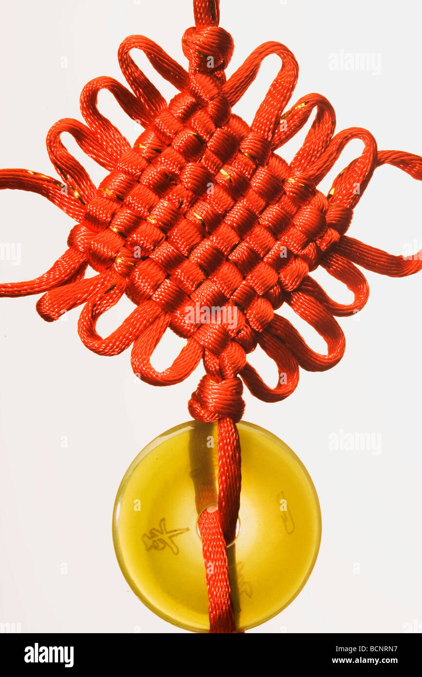 Chinese knot with jade piece Stock Photo - Alamy