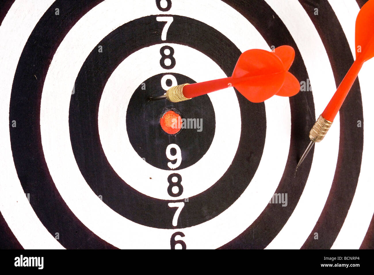 Close up of dards on dartboard Stock Photo - Alamy