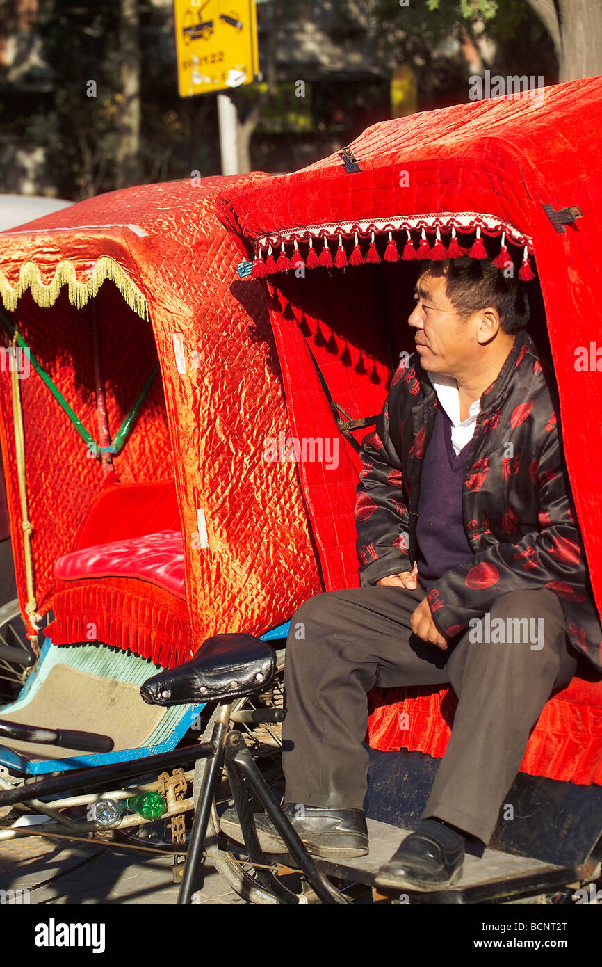 Rickshaw driver waiting for customer, Beijing, China Stock Photo - Alamy