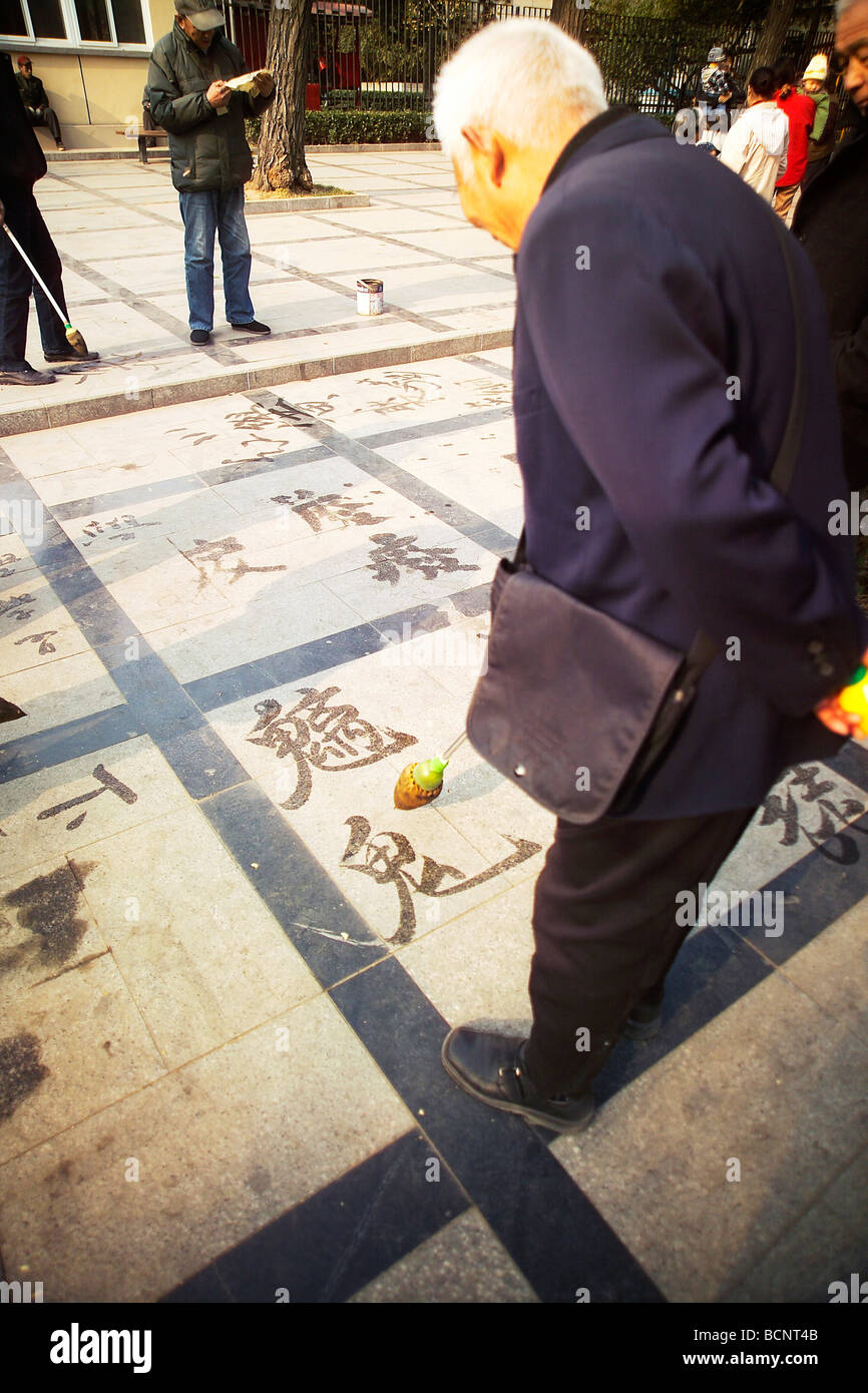 Elderly man practicing calligraphy hi-res stock photography and images ...