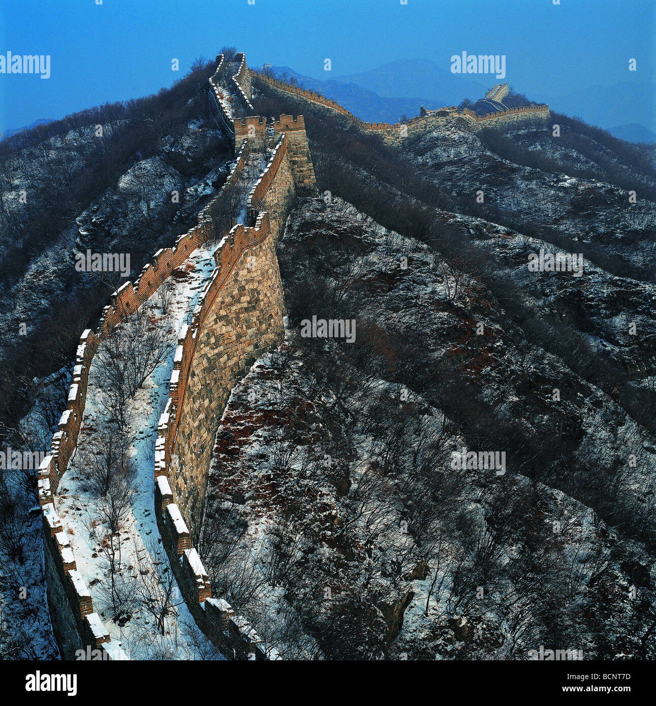 Jiankou Great Wall winding through steep mountain range in winter ...