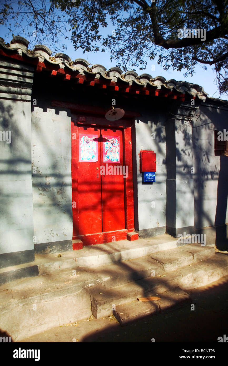 Red front gate of a courtyard house in a typical hutong, Beijing, China ...