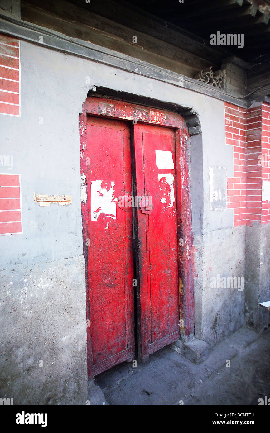 Faded red courtyard gate in a typical Hutong, Beijing, China Stock ...