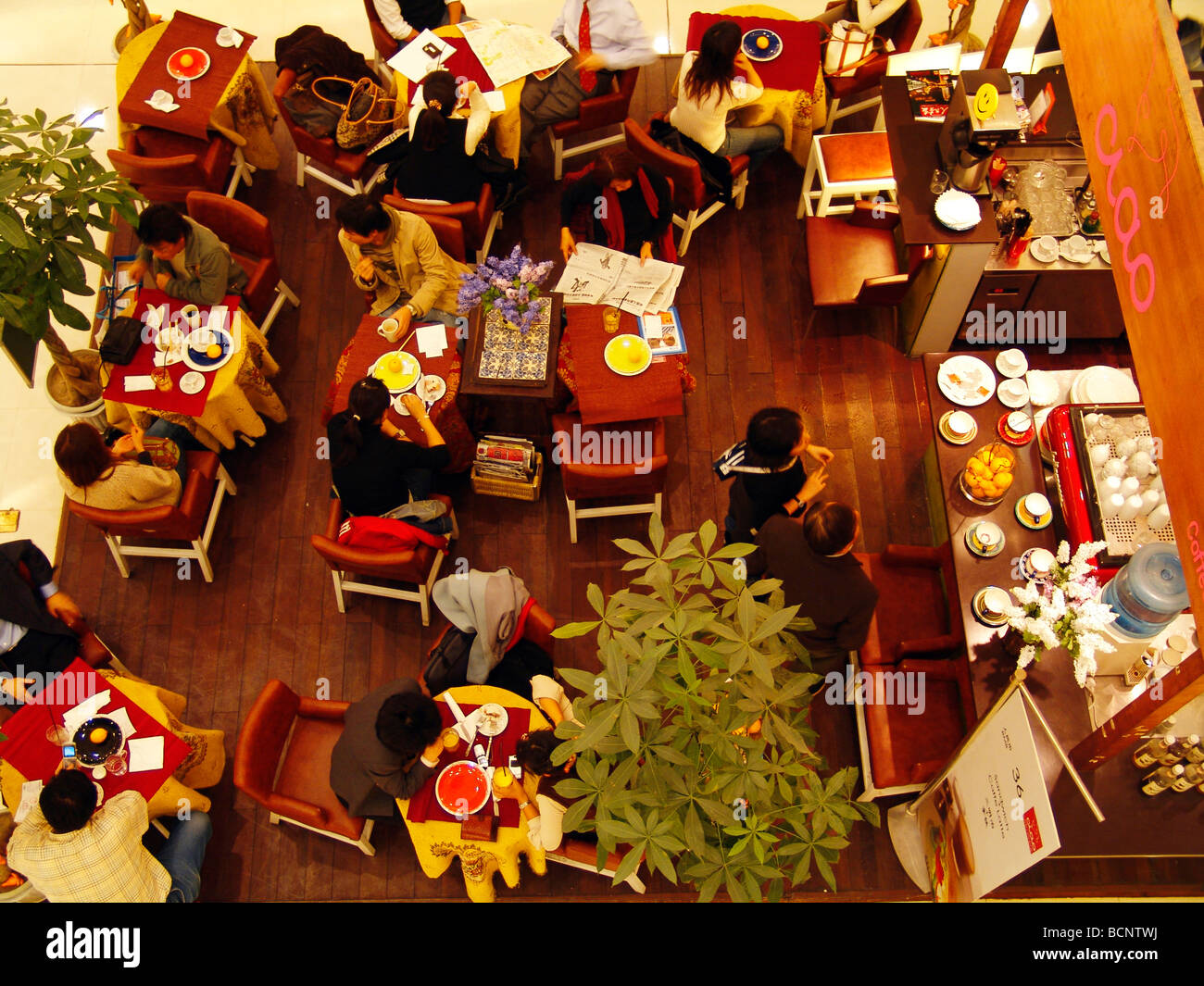 People enjoying coffee at local coffee shop, Beijing, China Stock Photo ...