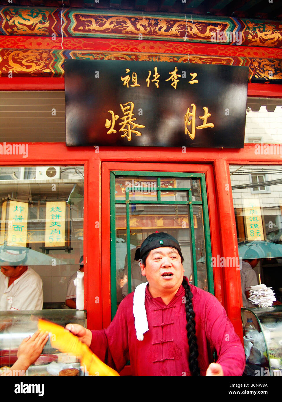Chinese man wearing traditional Qing Dynasty outfit calling for ...