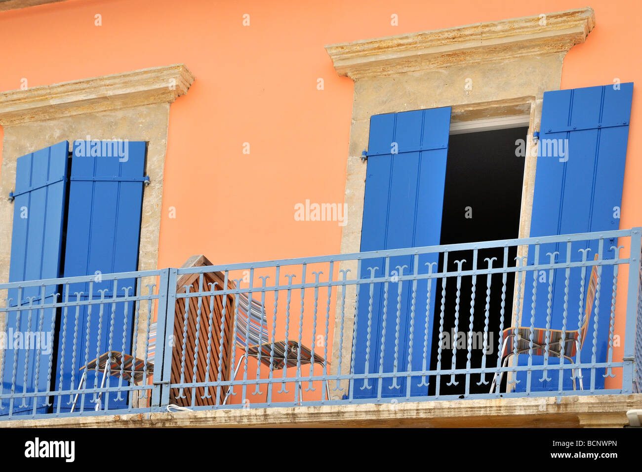Greek balcony with blue blinds Stock Photo - Alamy