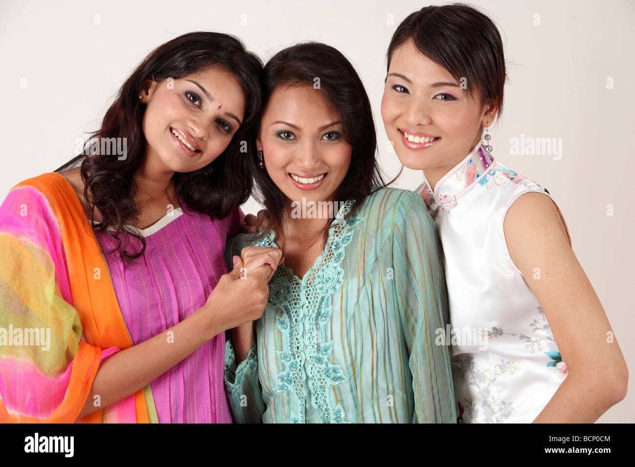 three friend holding hands together Stock Photo - Alamy