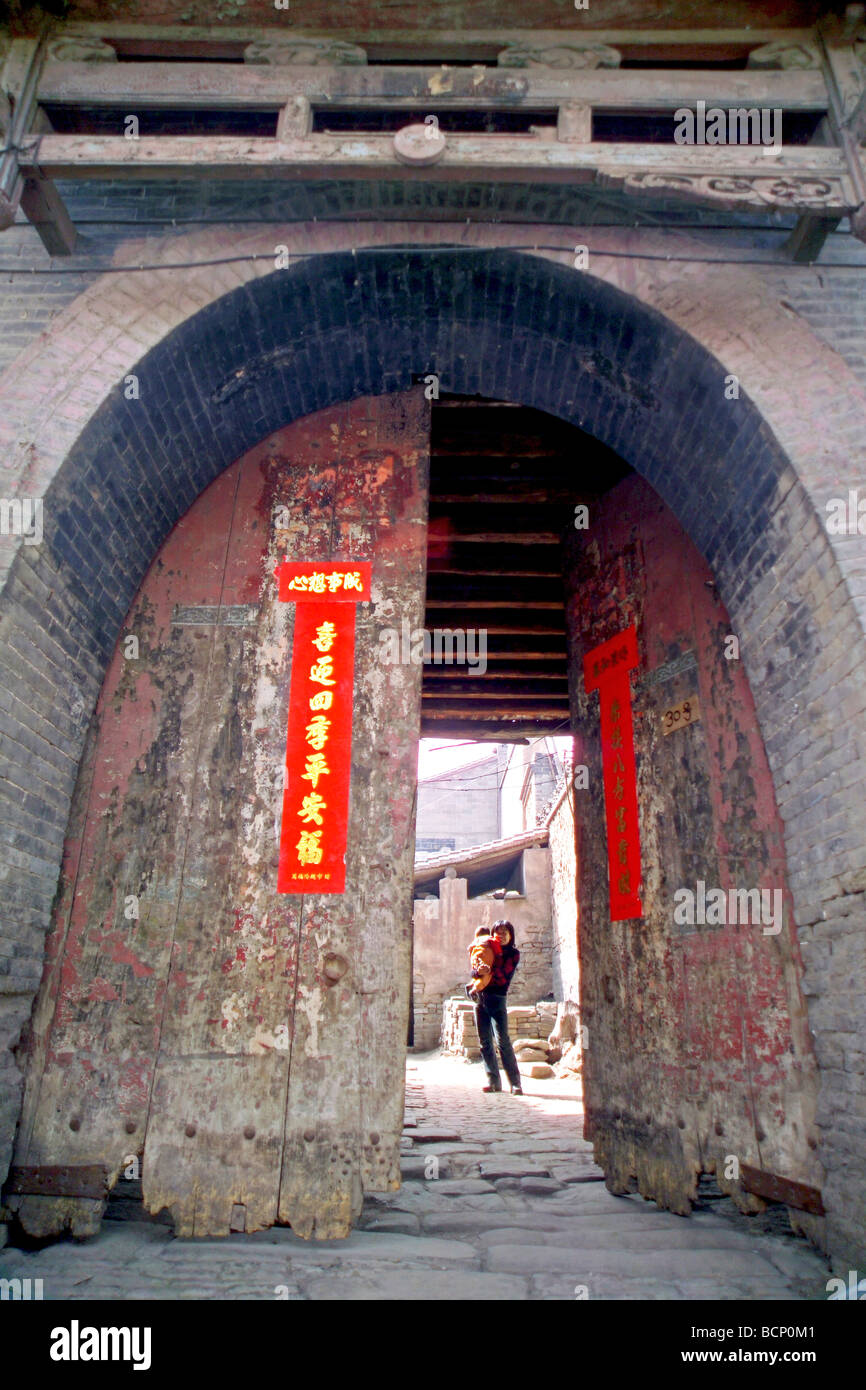 Front gate of a large traditional courtyard house, Pingyao, Shanxi ...