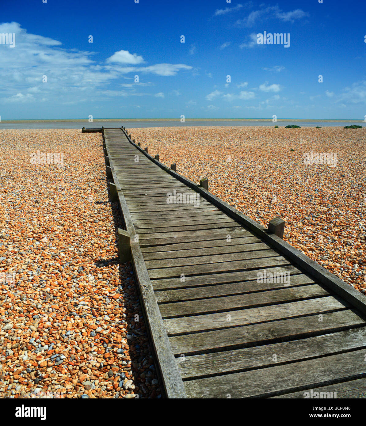 Wooden walkway leading to the sea Stock Photo - Alamy