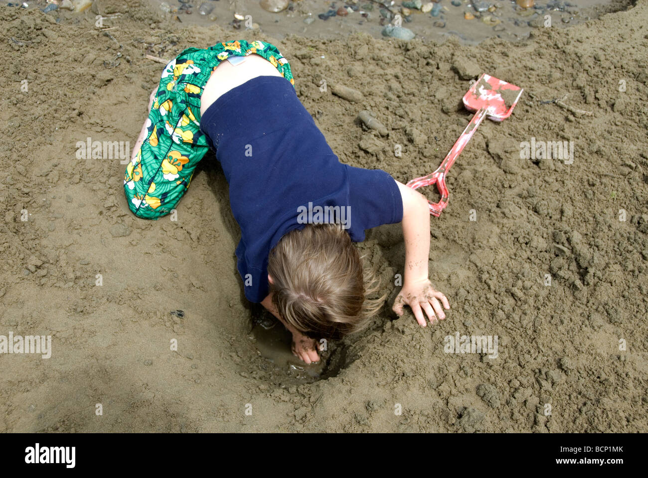 Playing dig digging hole hi-res stock photography and images - Alamy
