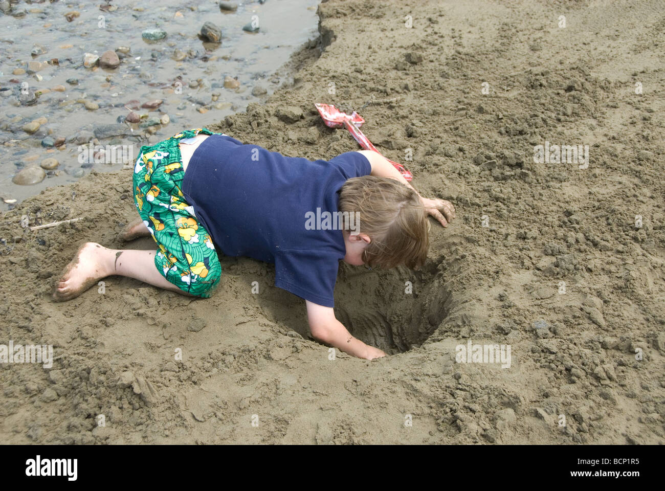 Playing dig digging hole hi-res stock photography and images - Alamy