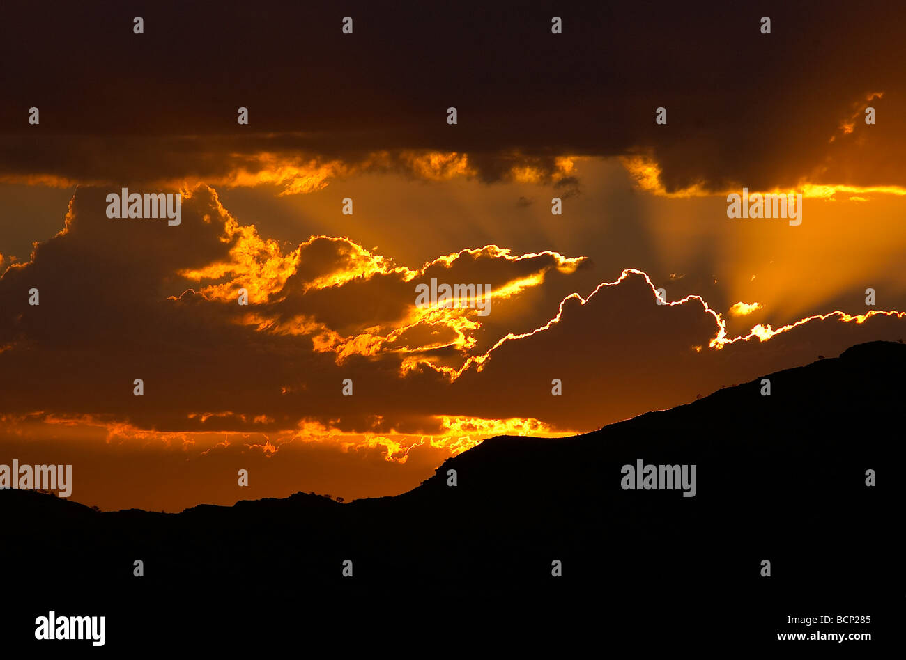 Dramatic sunset and sunburst through evening clouds Namibia Africa ...