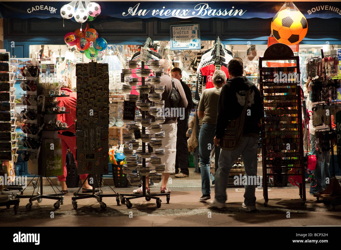 Late night shopping in Honfleur, normandy, France Stock Photo - Alamy