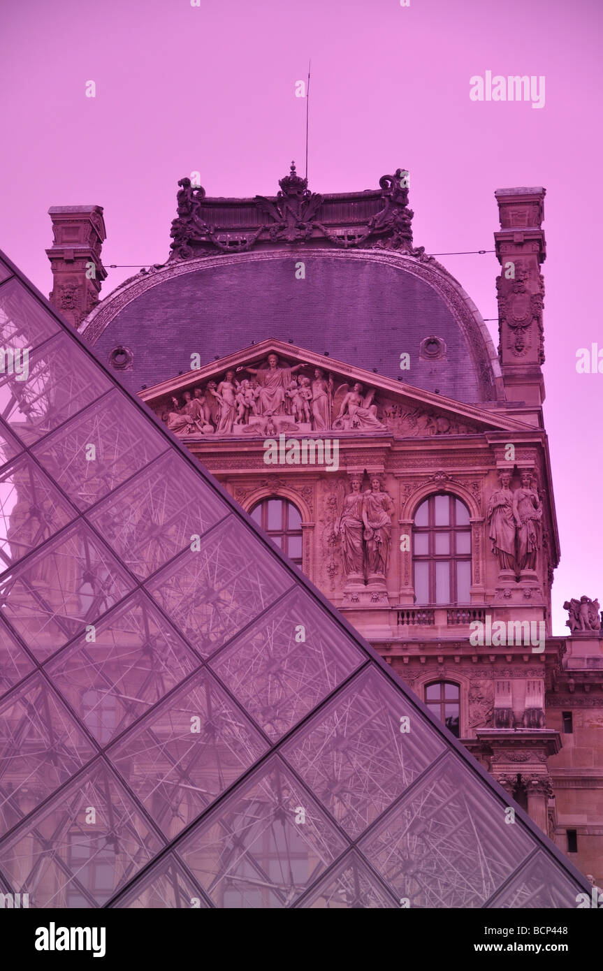 Louvre pyramid in Paris at sunrise Stock Photo - Alamy