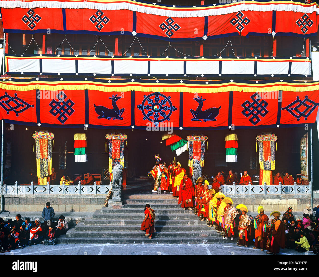 Lamas performing ritual during Cham Ceremony in Dongzhulin Monastery ...