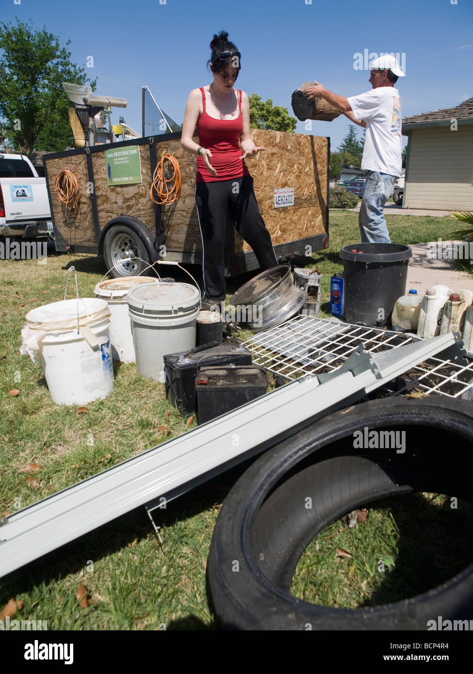 Thomas Longmore and chis crew of AAA restoration worke clean up a bank ...