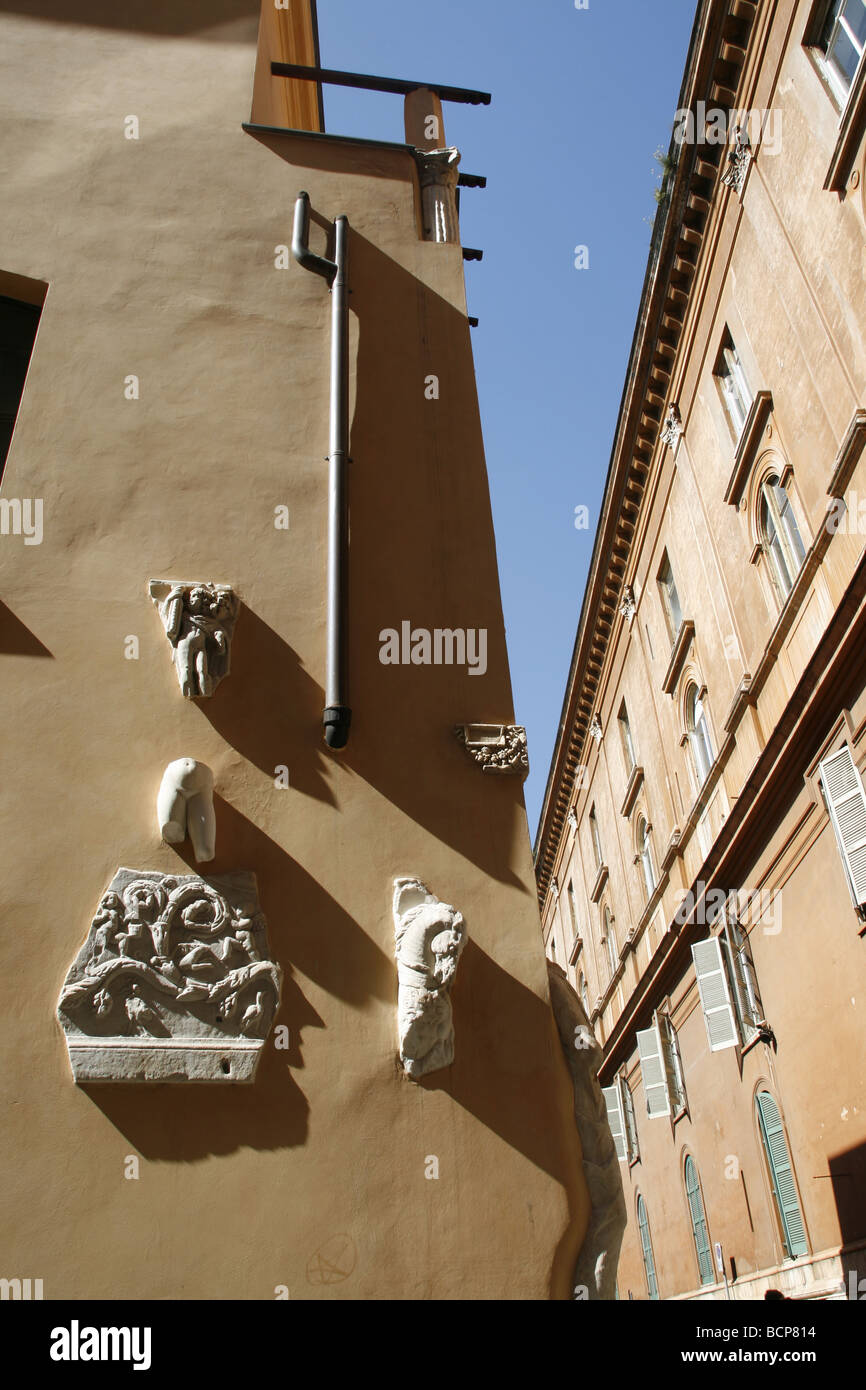 ancient roman relics on property wall near via del corso street in rome ...