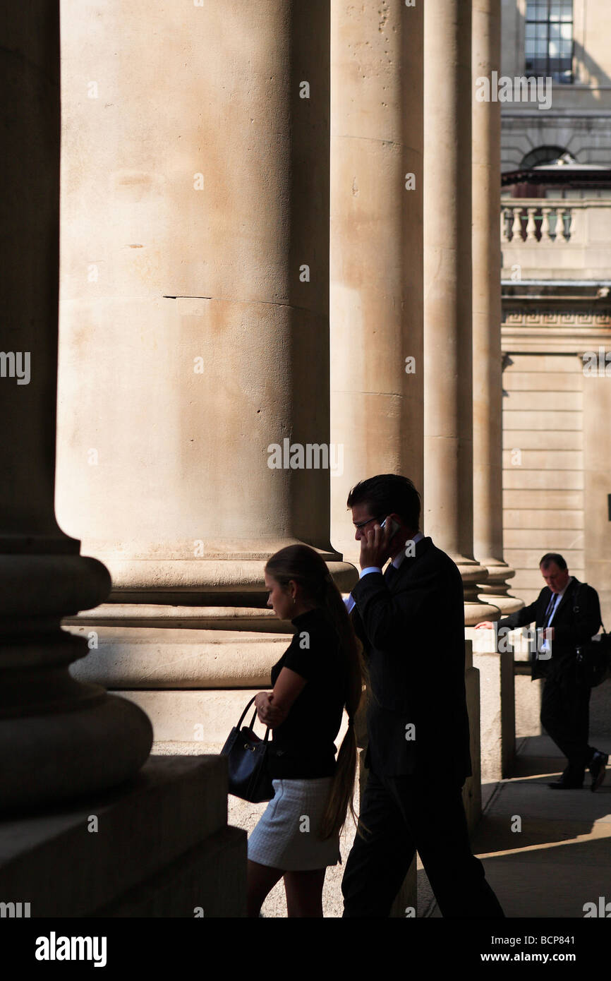 People leaving royal Exchange and talking on the phone The Bank, City ...